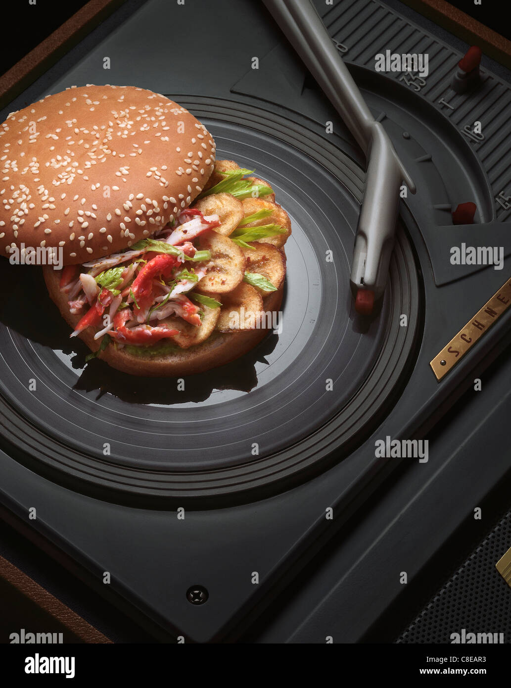 Exotic hamburger on a record player Stock Photo - Alamy
