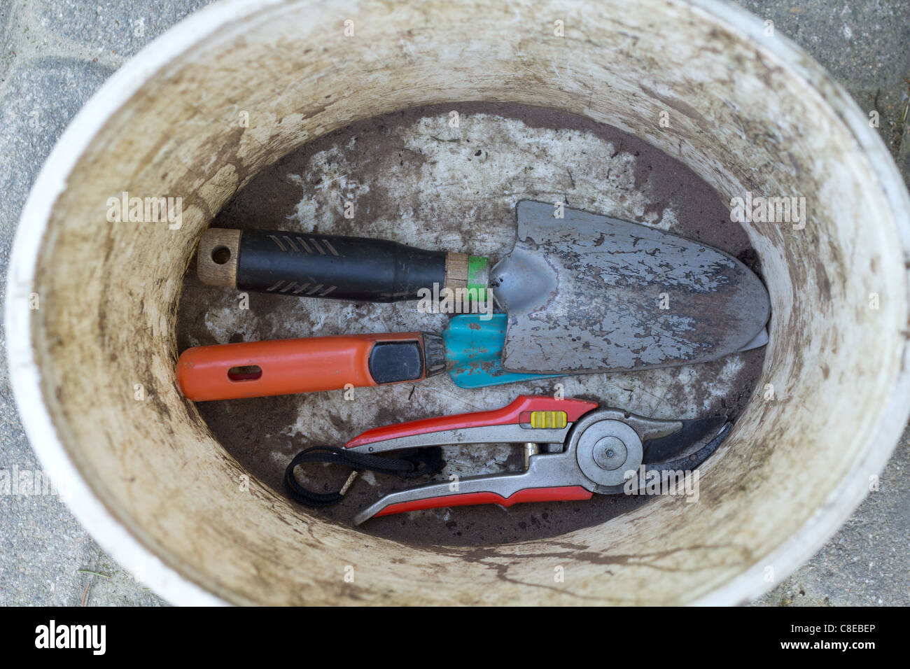 gardening tools in a dirty bucket Stock Photo - Alamy