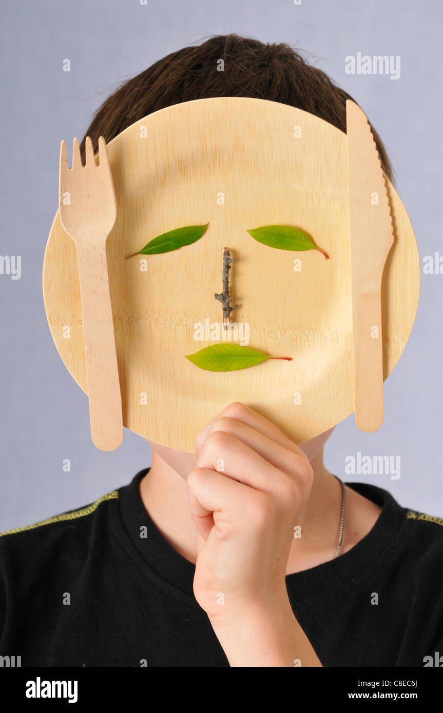 Child playing with a wooden plate Stock Photo - Alamy