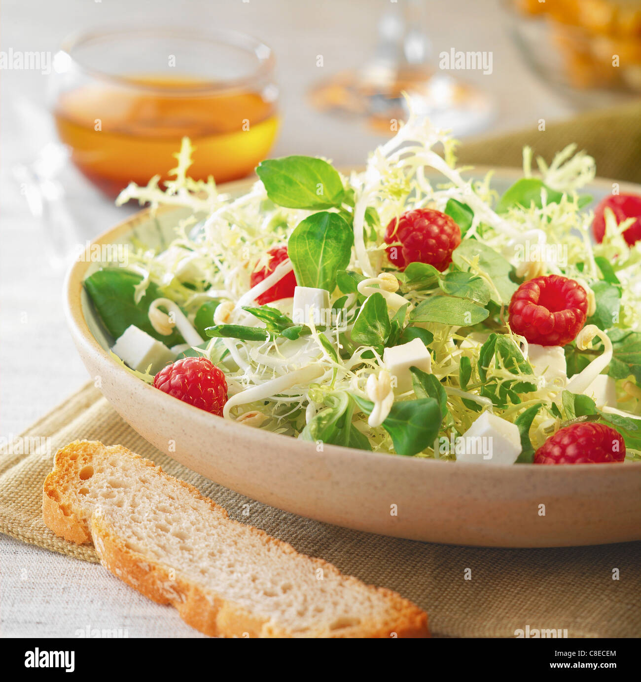 Corn salad,curly endive,raspberry and feta salad Stock Photo - Alamy