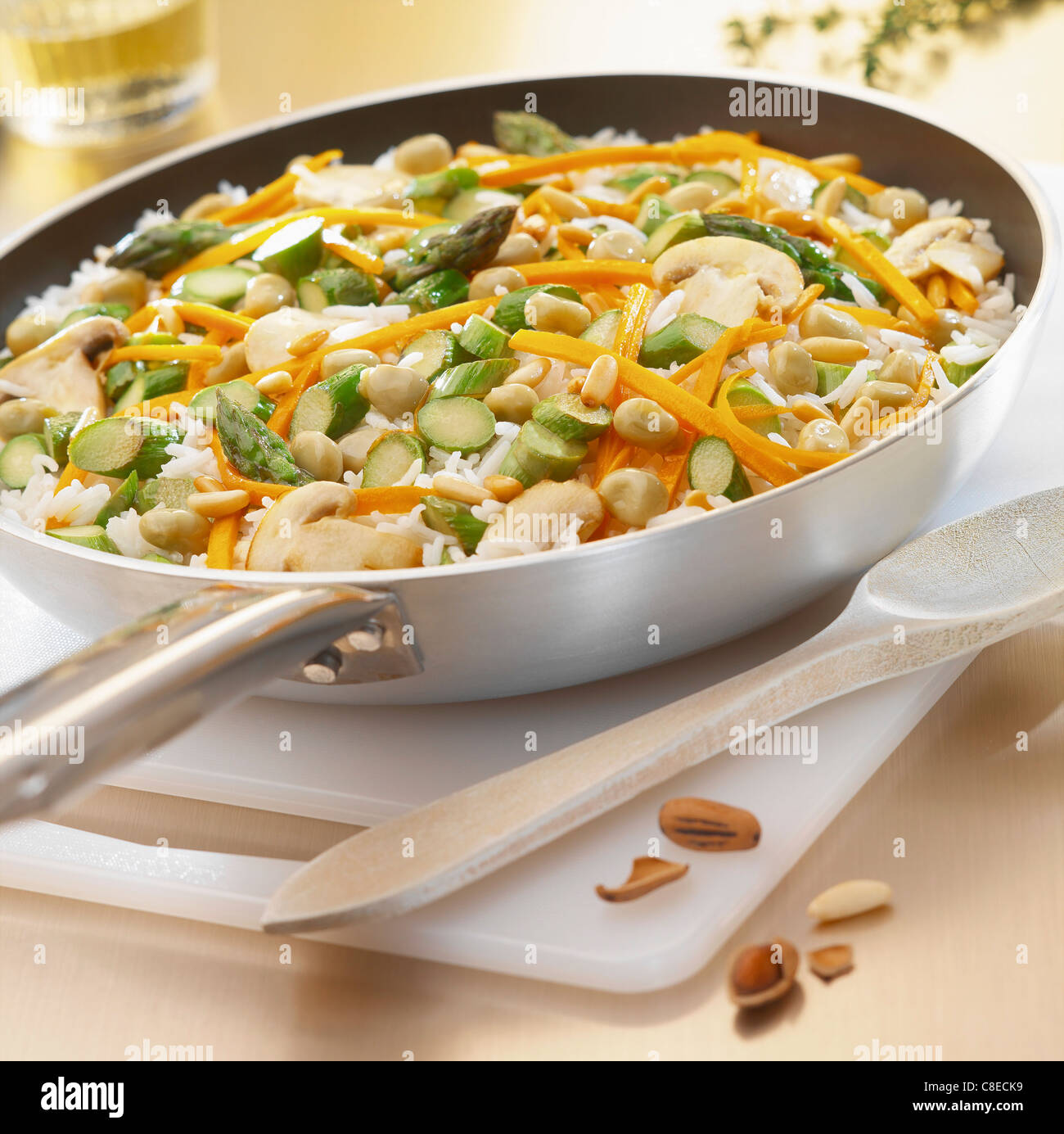 Rice,vegetable and pine nut stir-fry Stock Photo - Alamy