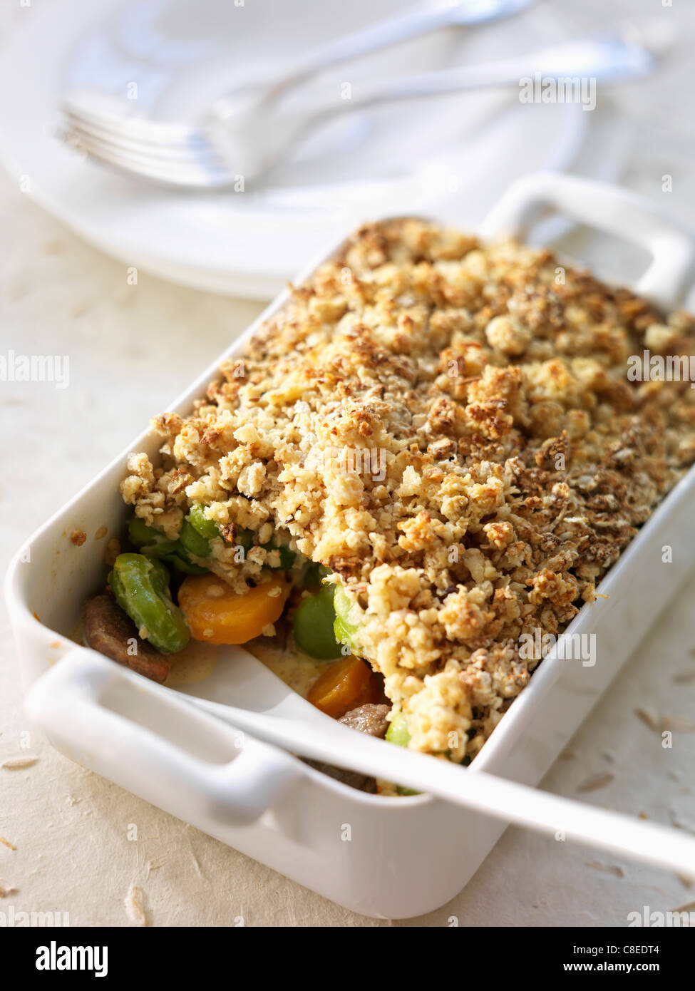 Lamb and vegetable savory oat crumble Stock Photo - Alamy