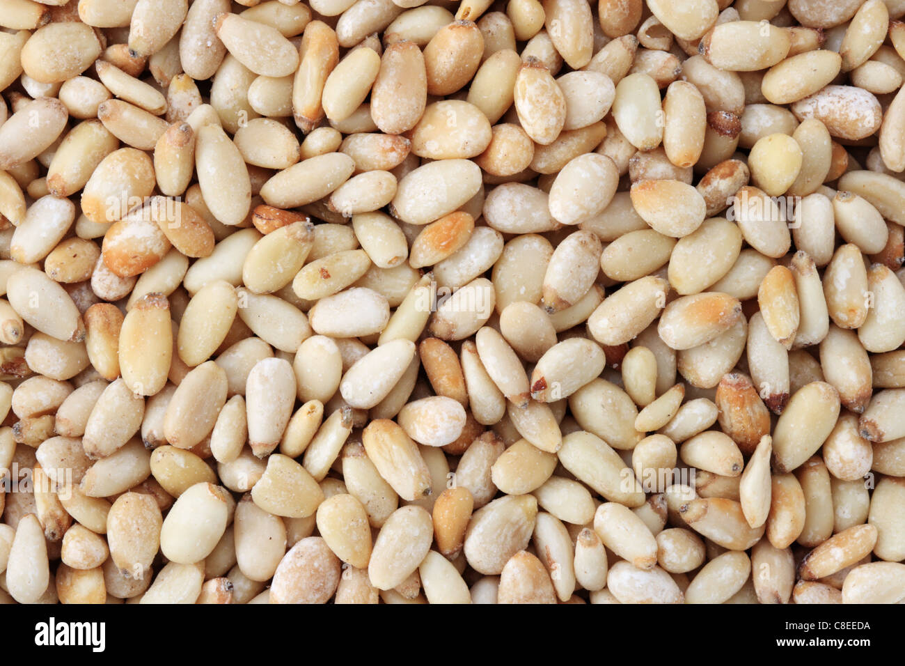 shelled pine nuts close up background image Stock Photo - Alamy