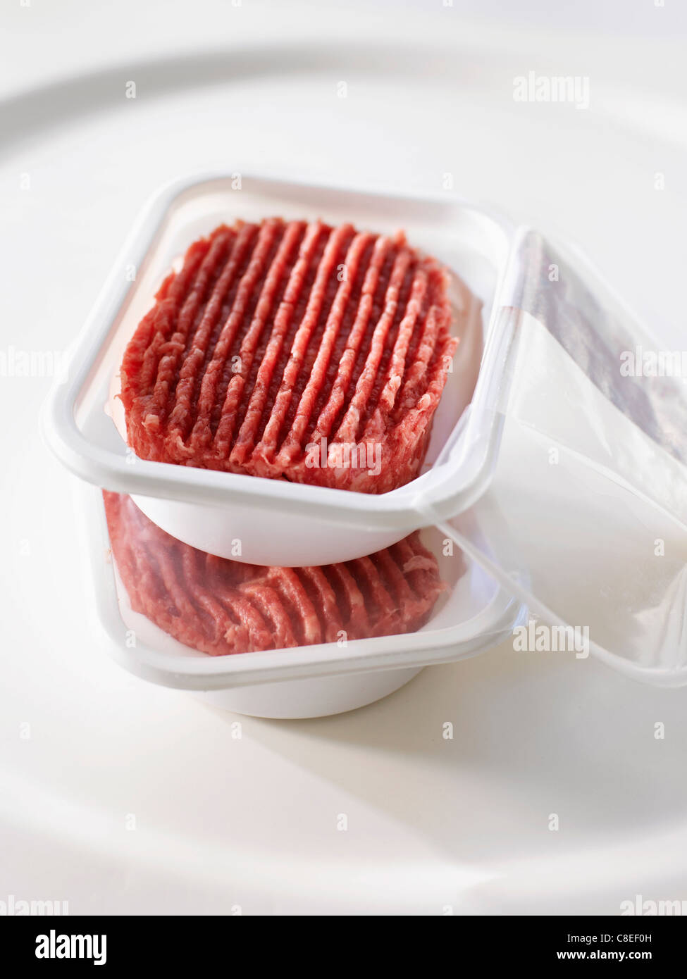 Raw hamburgers in their packs Stock Photo - Alamy