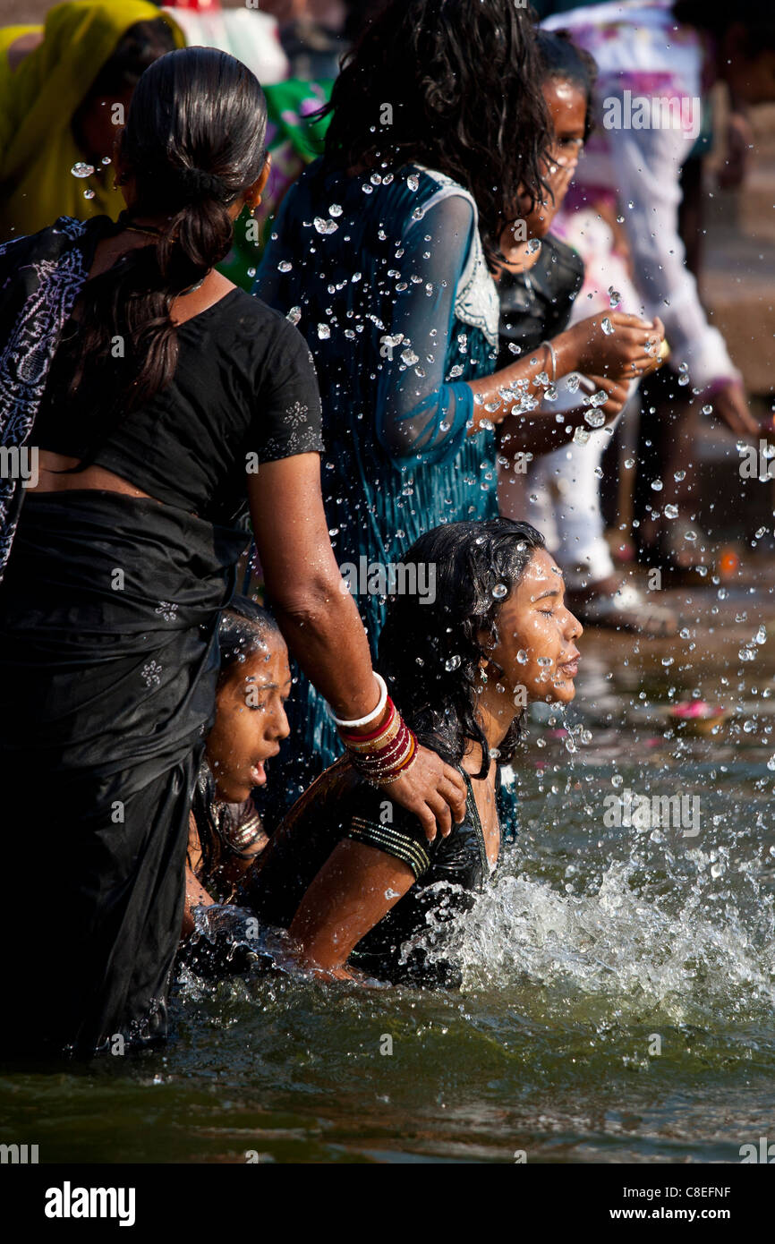 Indian man bathing washing clothes hi-res stock photography and images ...