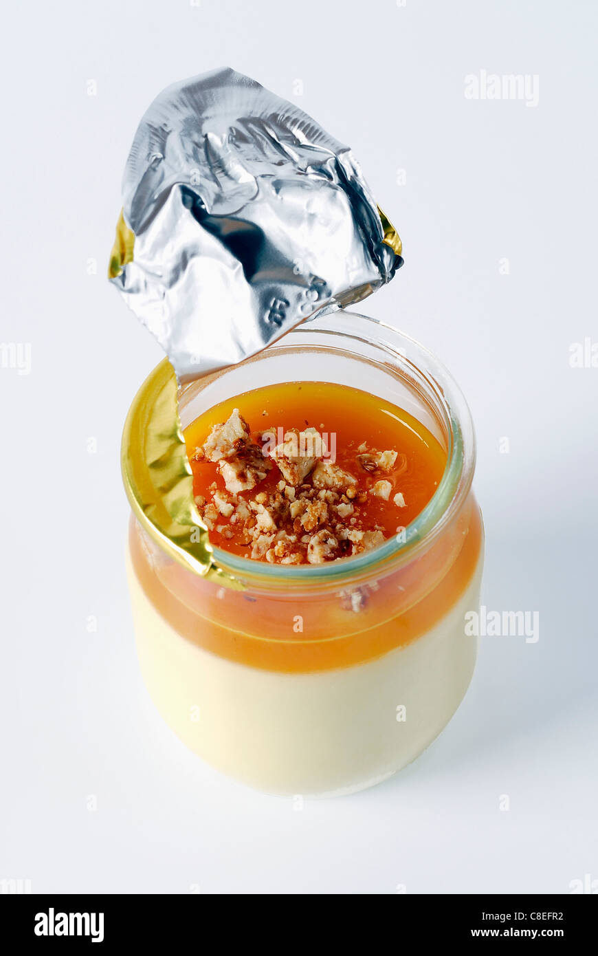 Glass pot of yoghurt with fruit puree Stock Photo - Alamy
