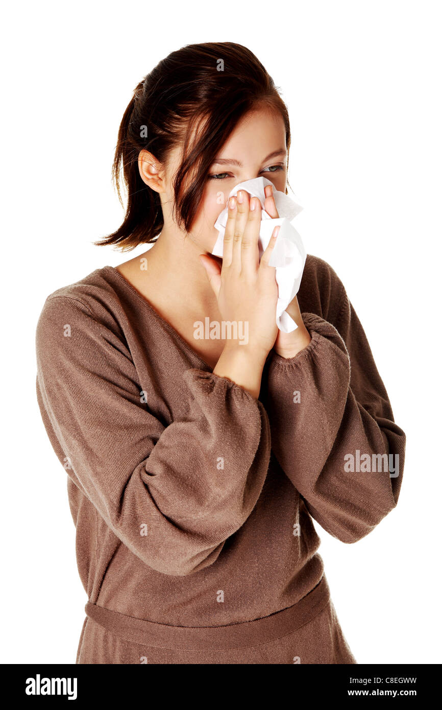 Young pretty caucasian girl blowing her nose. Isoalted on white Stock ...