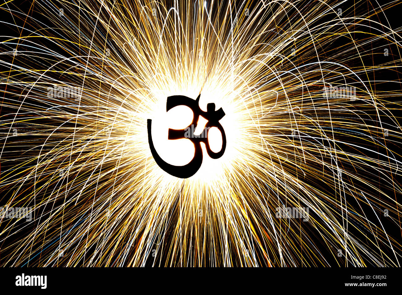 Hindu OM / AUM in front of firework sparks Stock Photo - Alamy