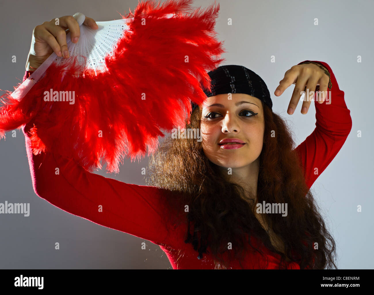 The young beautiful gipsy girl in red Stock Photo - Alamy