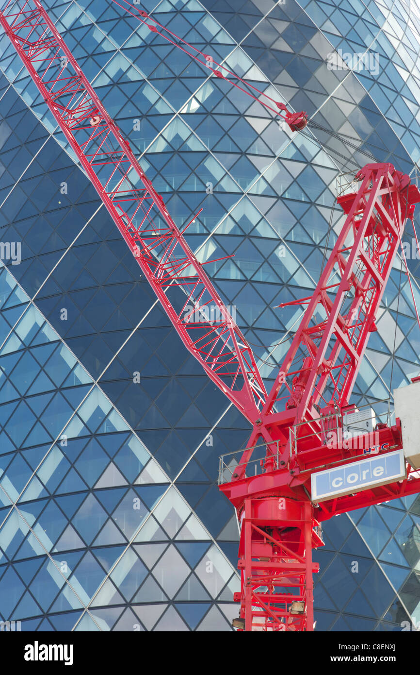 Red Construction CranE in Front of the Gherkin in the City of London ...