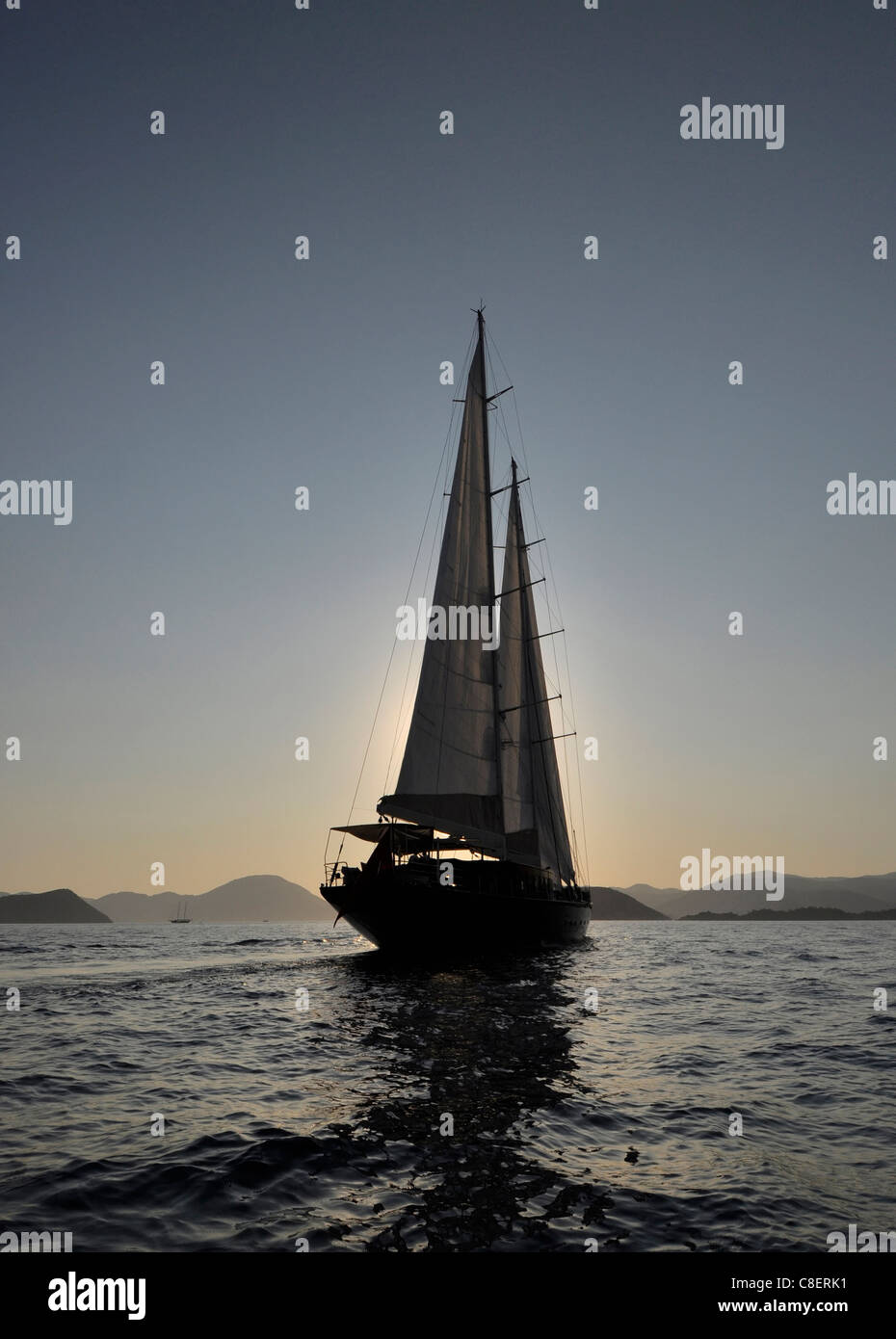 black classic style wooden sailboat, sailing at the Mediterranean sea ...