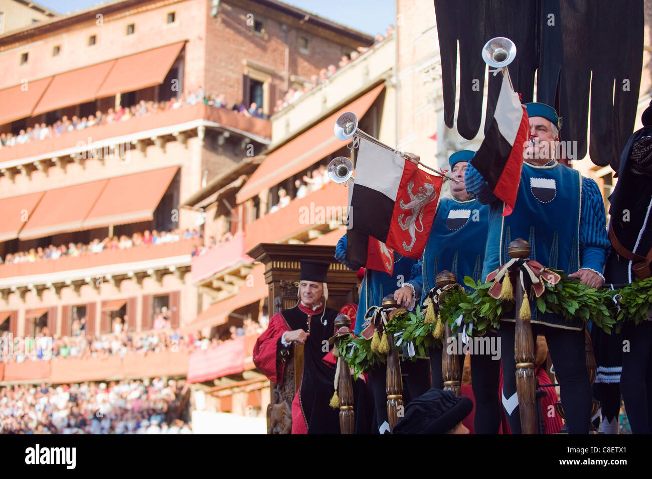 Bugle player in a parade at El Palio horse race festival, Piazza del ...