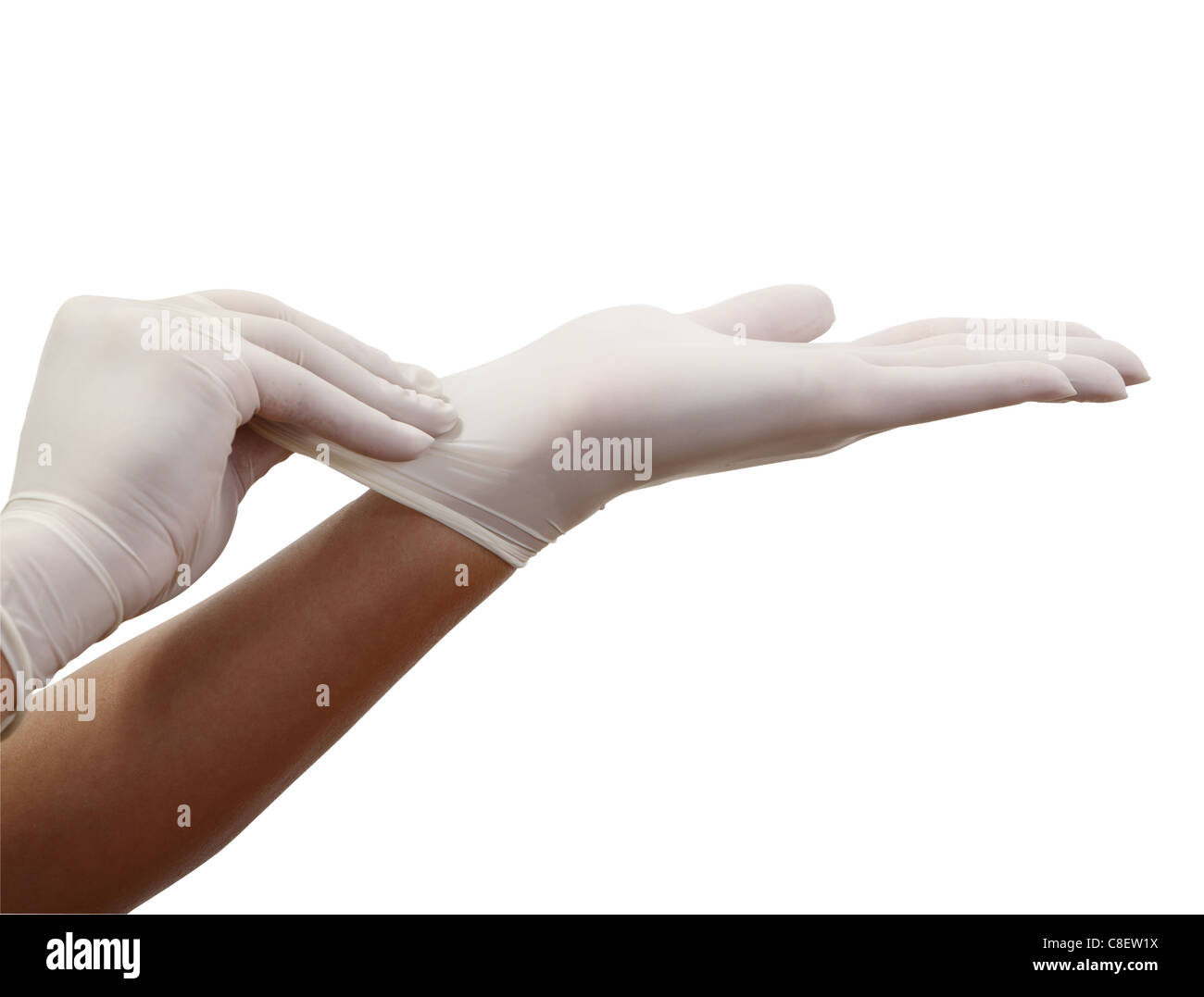 Woman hand putting on surgical gloves-isolation over white background ...