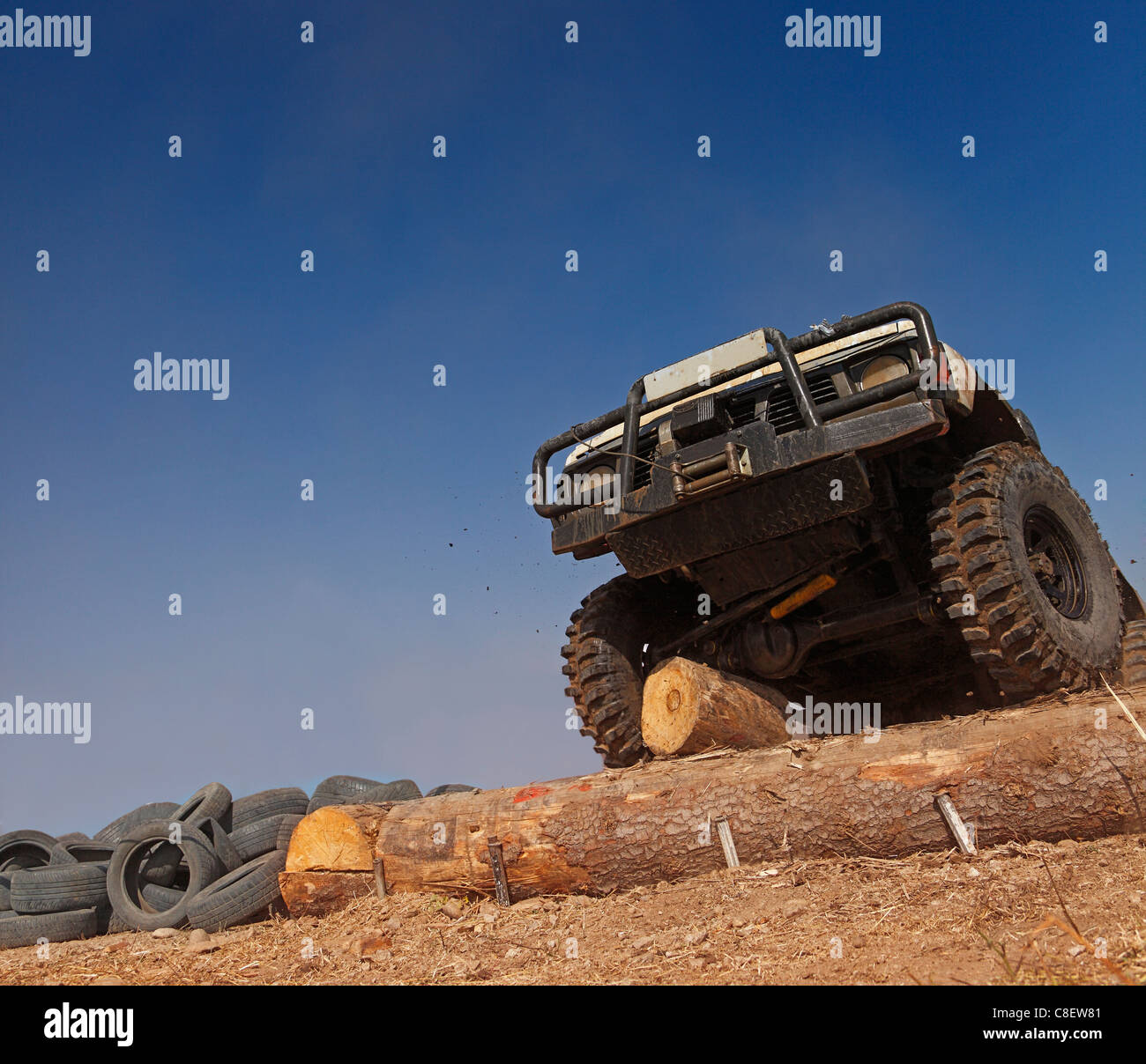 Off road car passing a tree trunk obstacle during a competition Stock ...