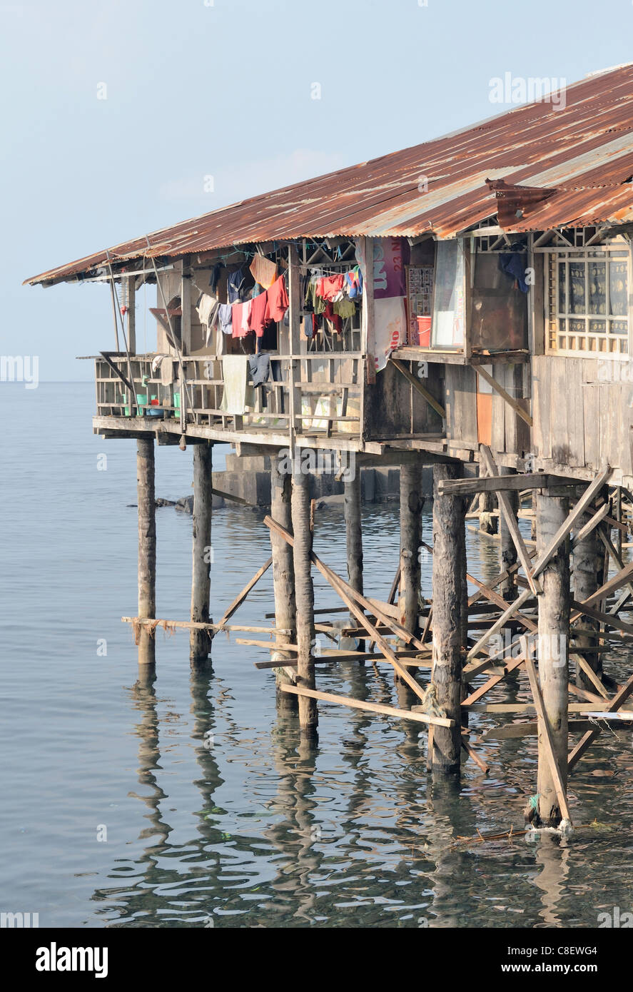 Asian wooden house on stilts overlooking ocean Stock Photo - Alamy