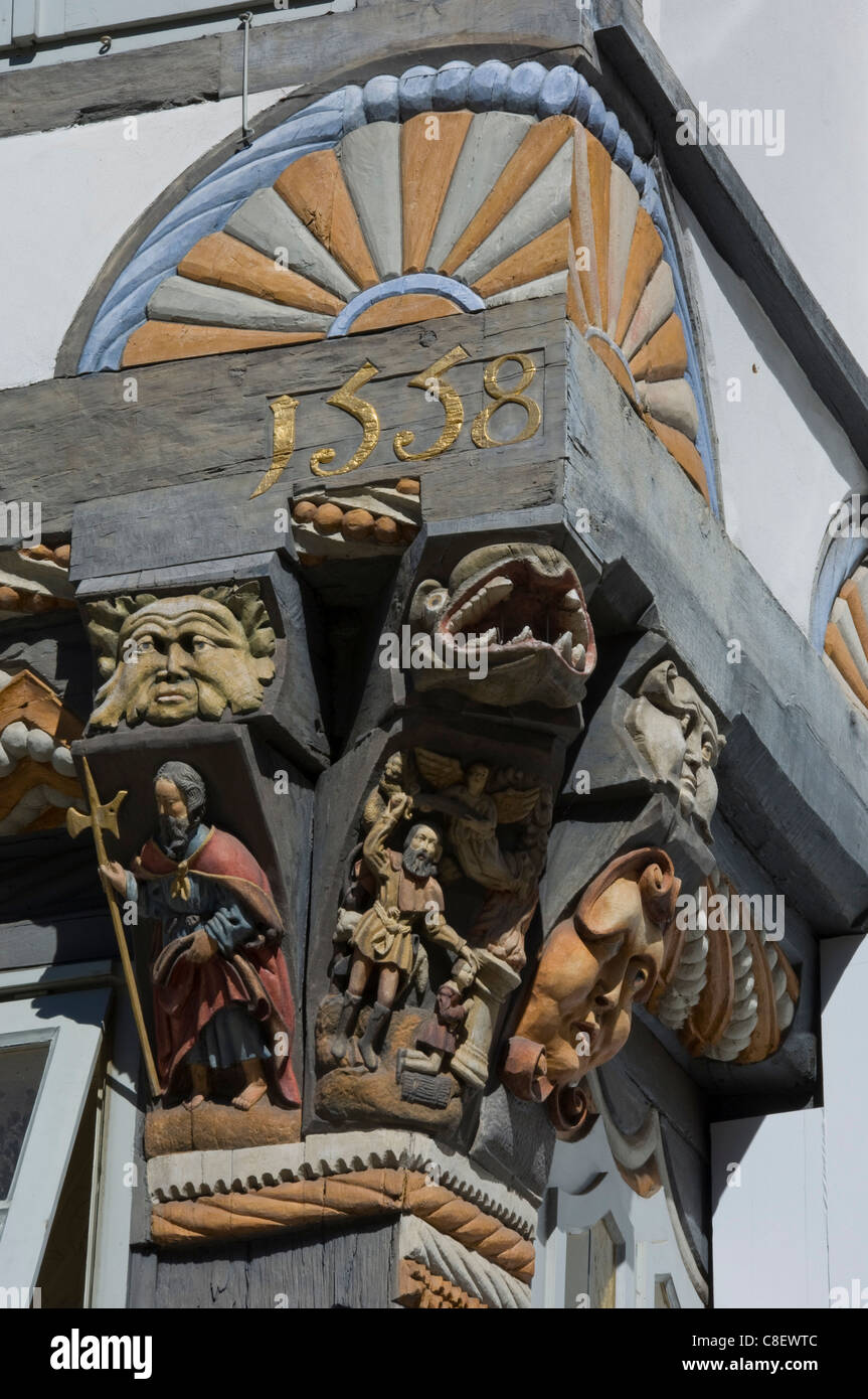 A 16th century carved and coloured corner bracketing, medieval building ...