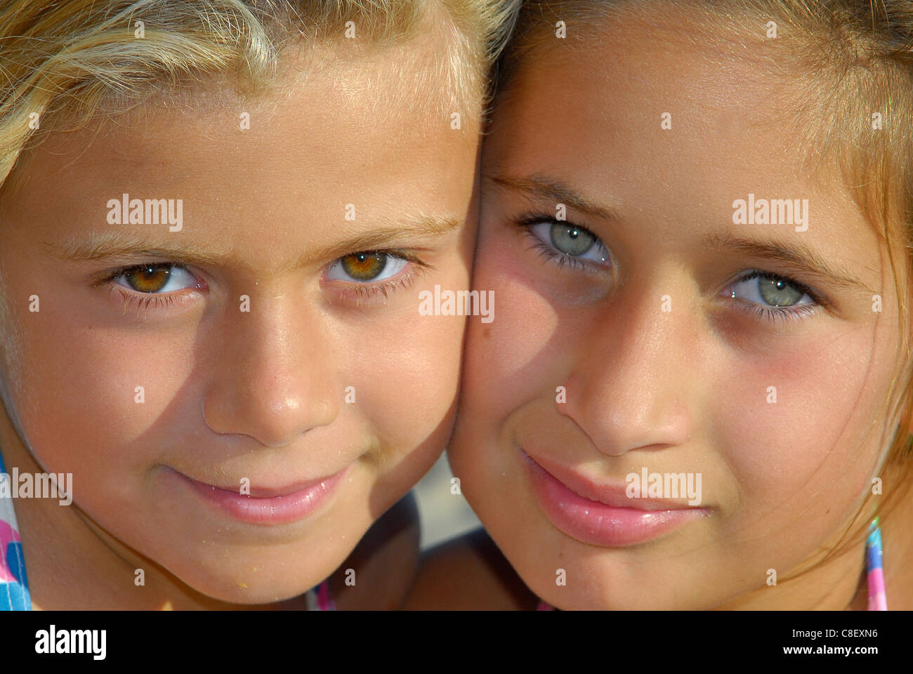 Two girl faces Stock Photo - Alamy