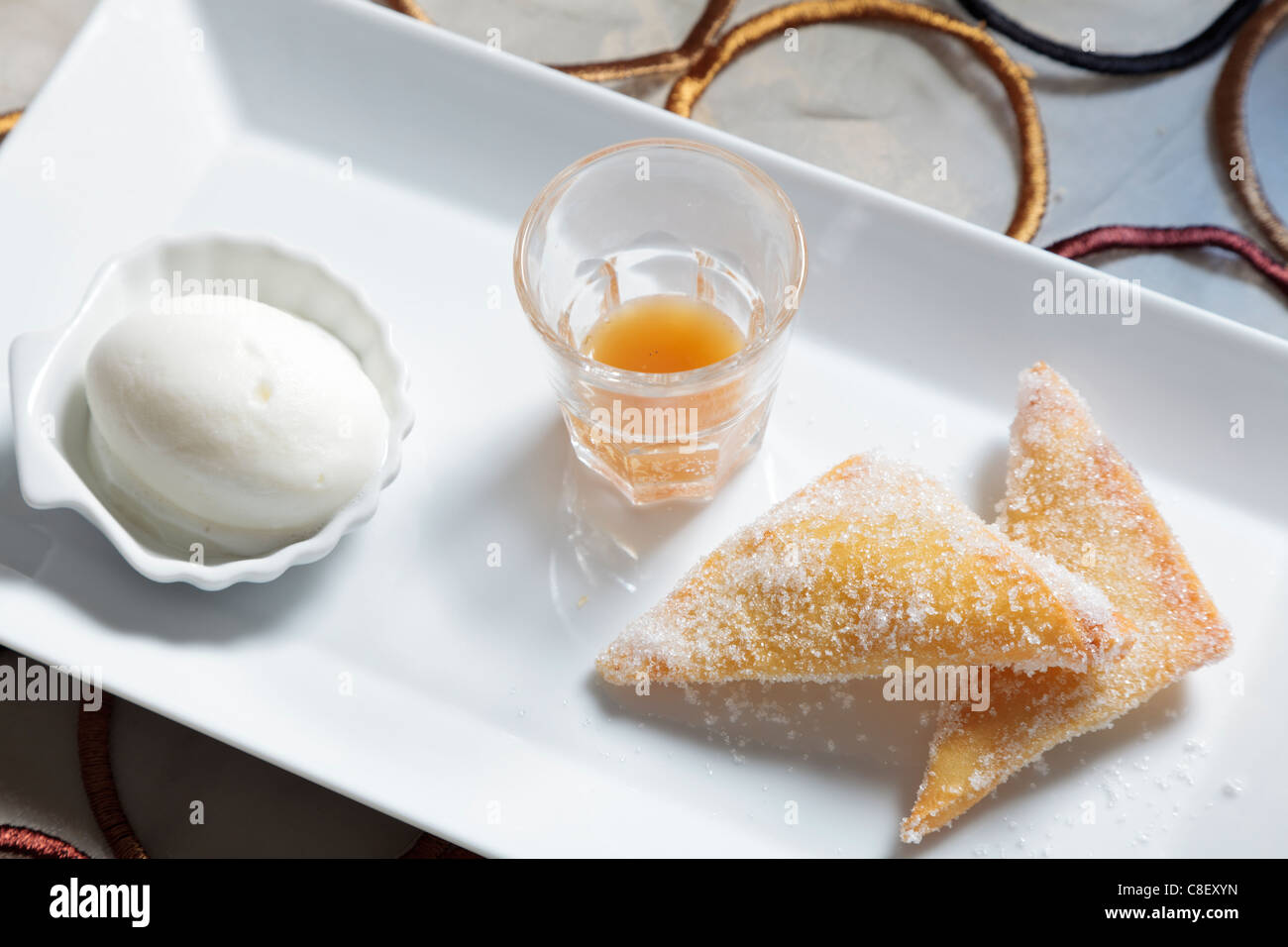 A fruit samosa with ice cream and a licor Stock Photo - Alamy