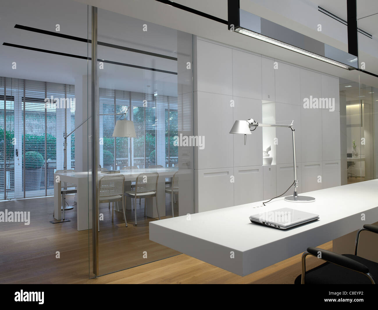 office space environment with desk and tables Stock Photo - Alamy