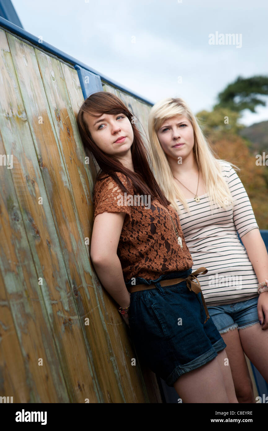 Two 16 17 year old teenage girls, hanging around waiting for something ...