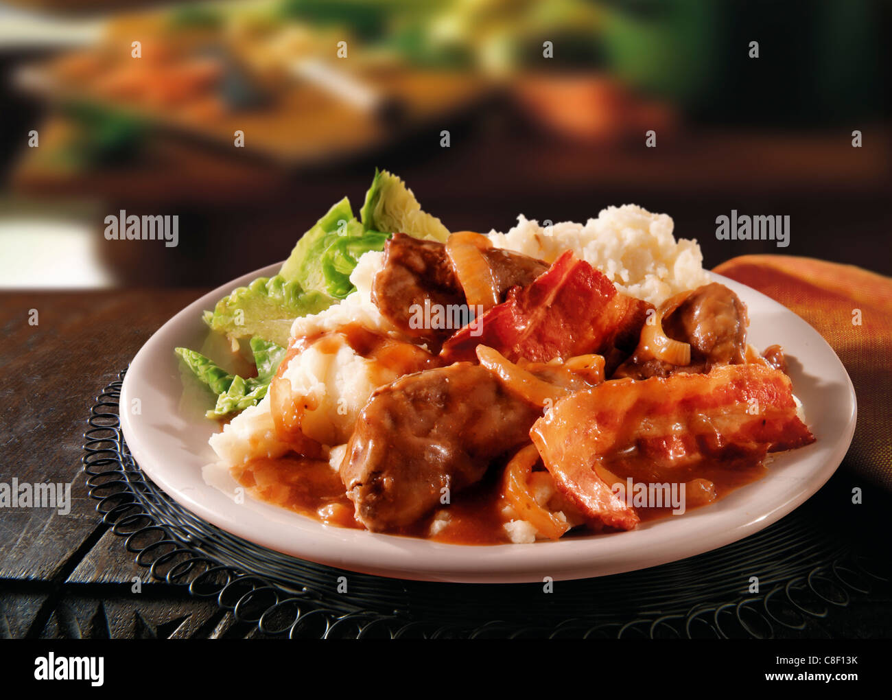 Traditional British Liver and Bacon casserole served with mashed ...