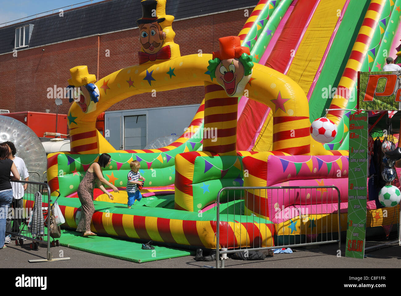 Inflatable fairground slide at seafront fair in Worthing, West Sussex ...