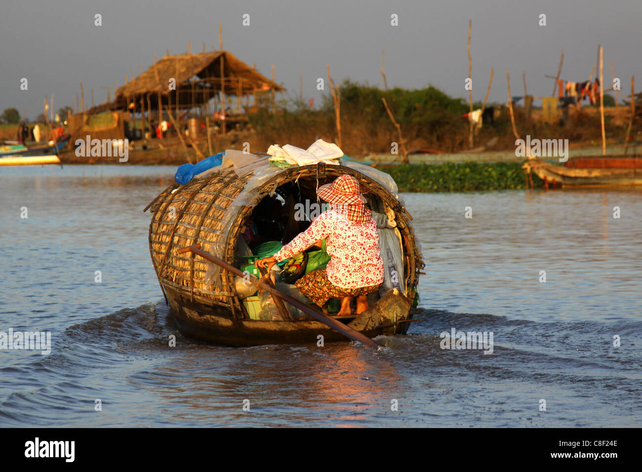 Local women on the Floating Shop Boat in floating village on Tonle Sap ...