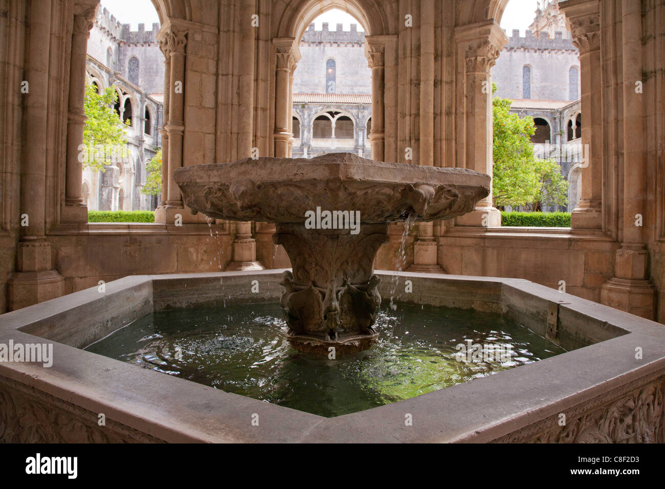 Monastery at Alcobaca - fountain and view through windows to cloistered ...