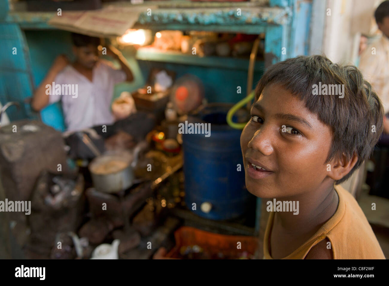 Young boy working at a Tea stall in an alleyway of Khari Baoli Road ...