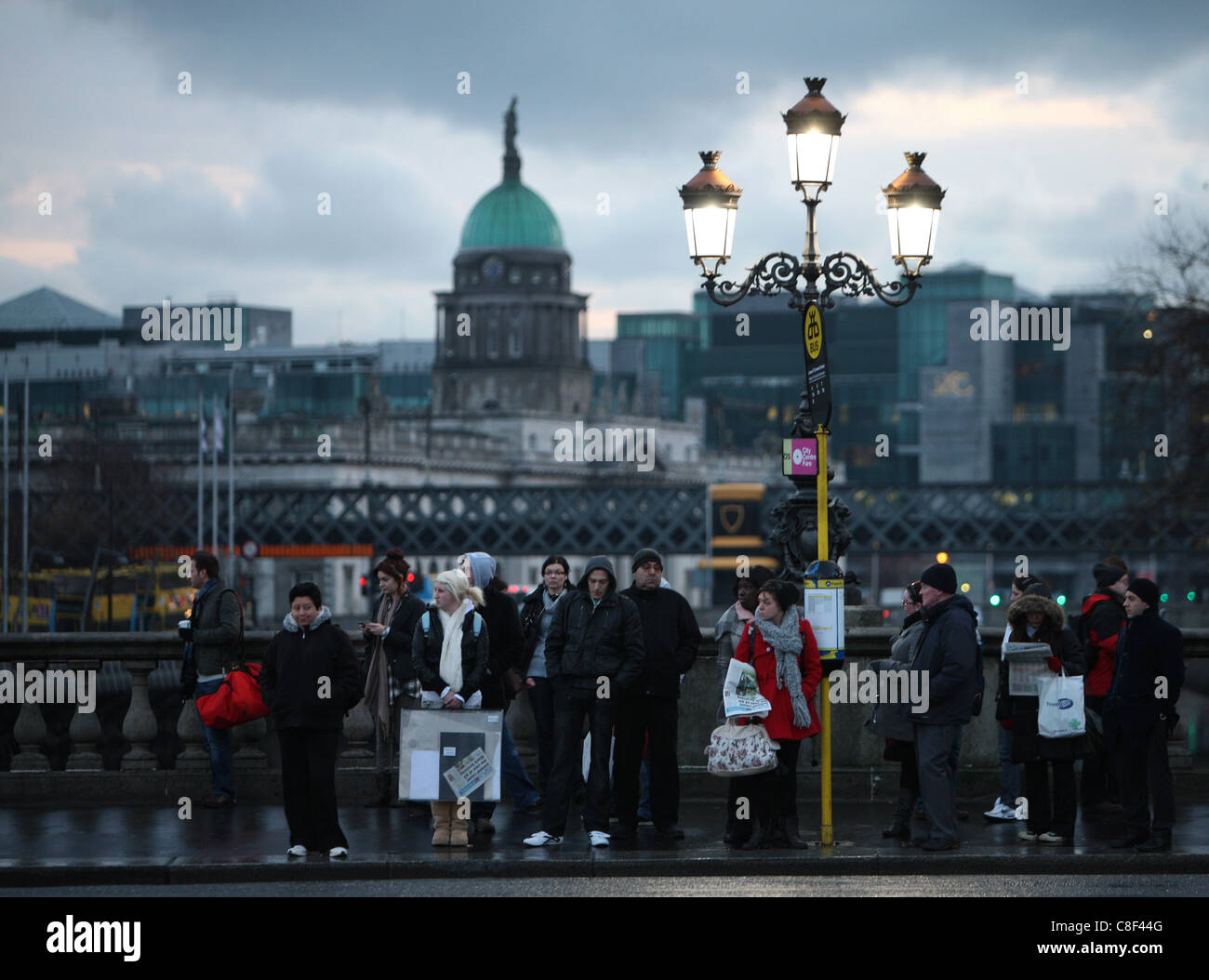 Commuters at bus stop hi-res stock photography and images - Alamy