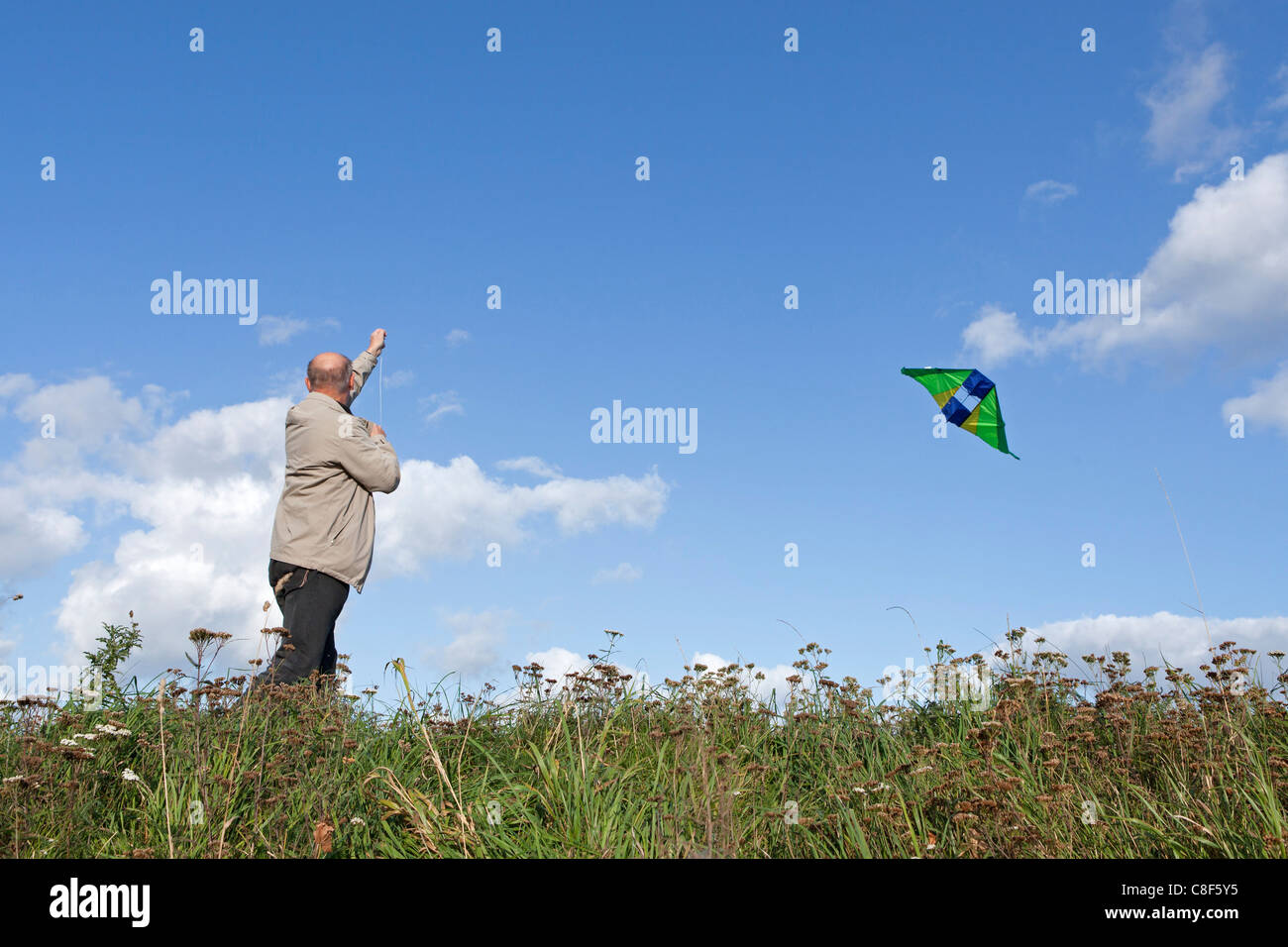 man flying a kite Stock Photo - Alamy