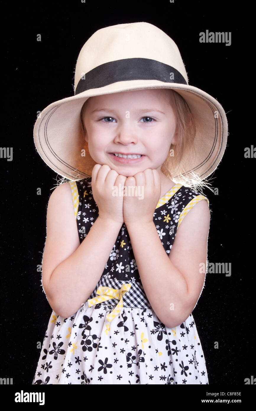 A high key rim lit image of an adorable child wearing a hat Stock Photo ...