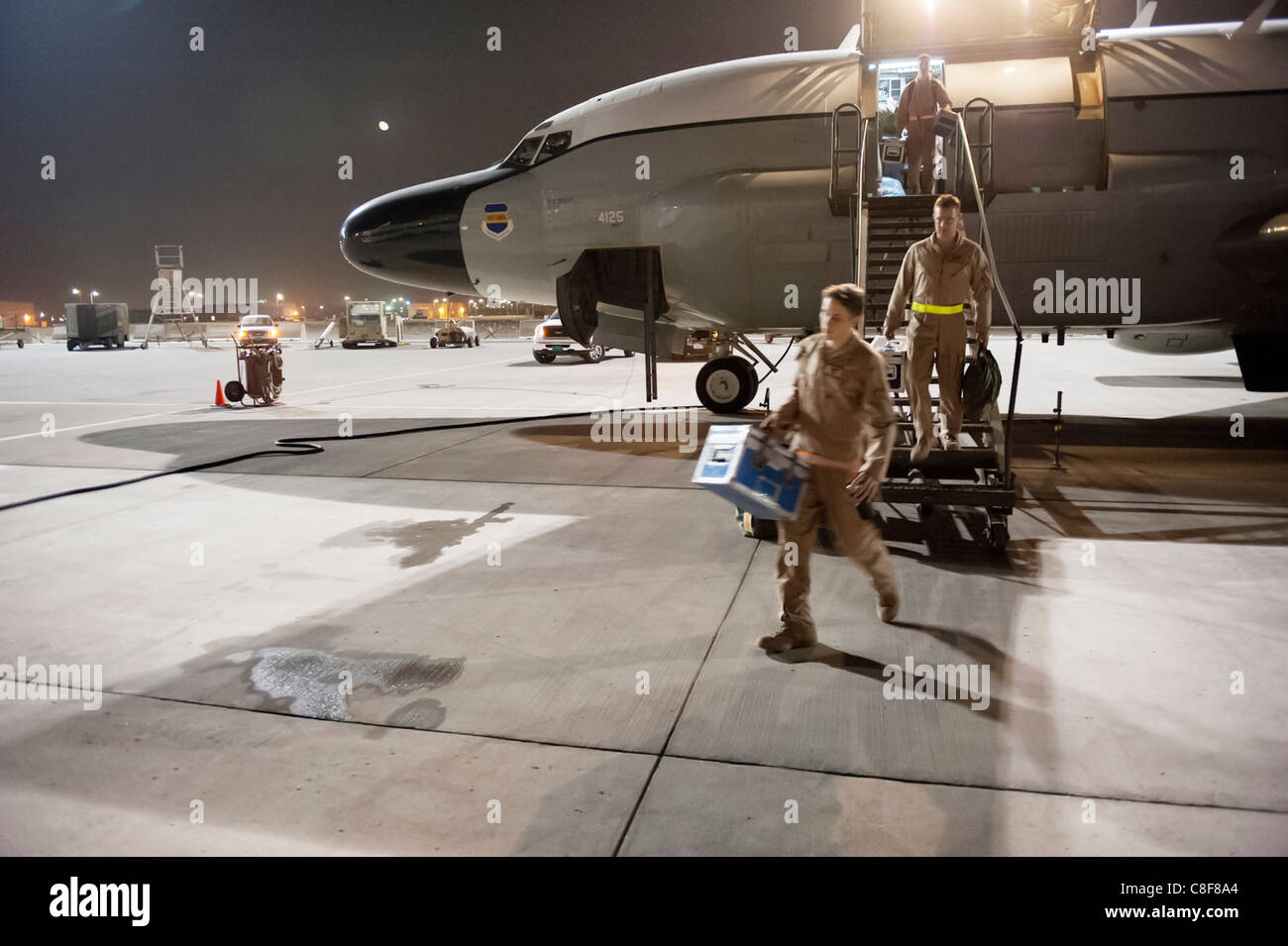 Crewmembers from the 763rd Expeditionary Reconnaissance Squadron exit a ...