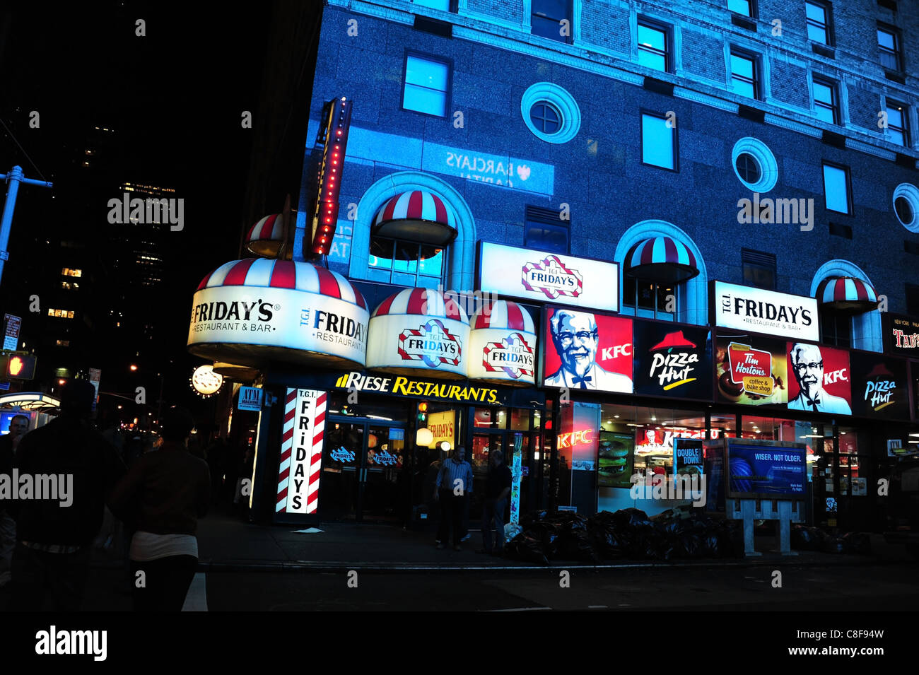 Night shot blue neon building facade, TGI Friday's Restaurant & Bar ...