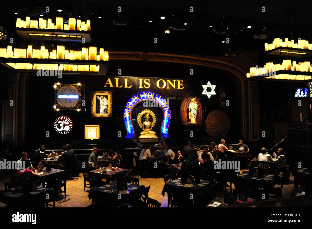 Interior view people sitting at tables, eating food, restaurant area ...