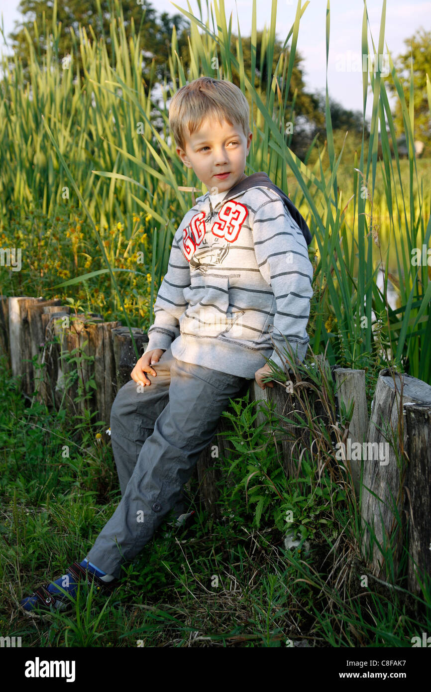 Boy watching carefully Stock Photo - Alamy