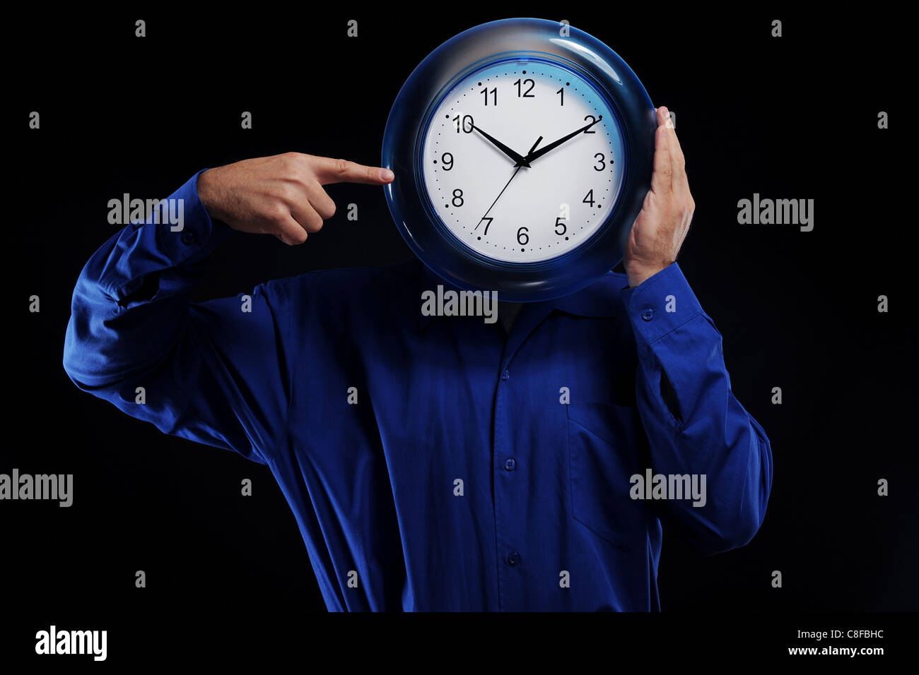 man holds hours Stock Photo - Alamy