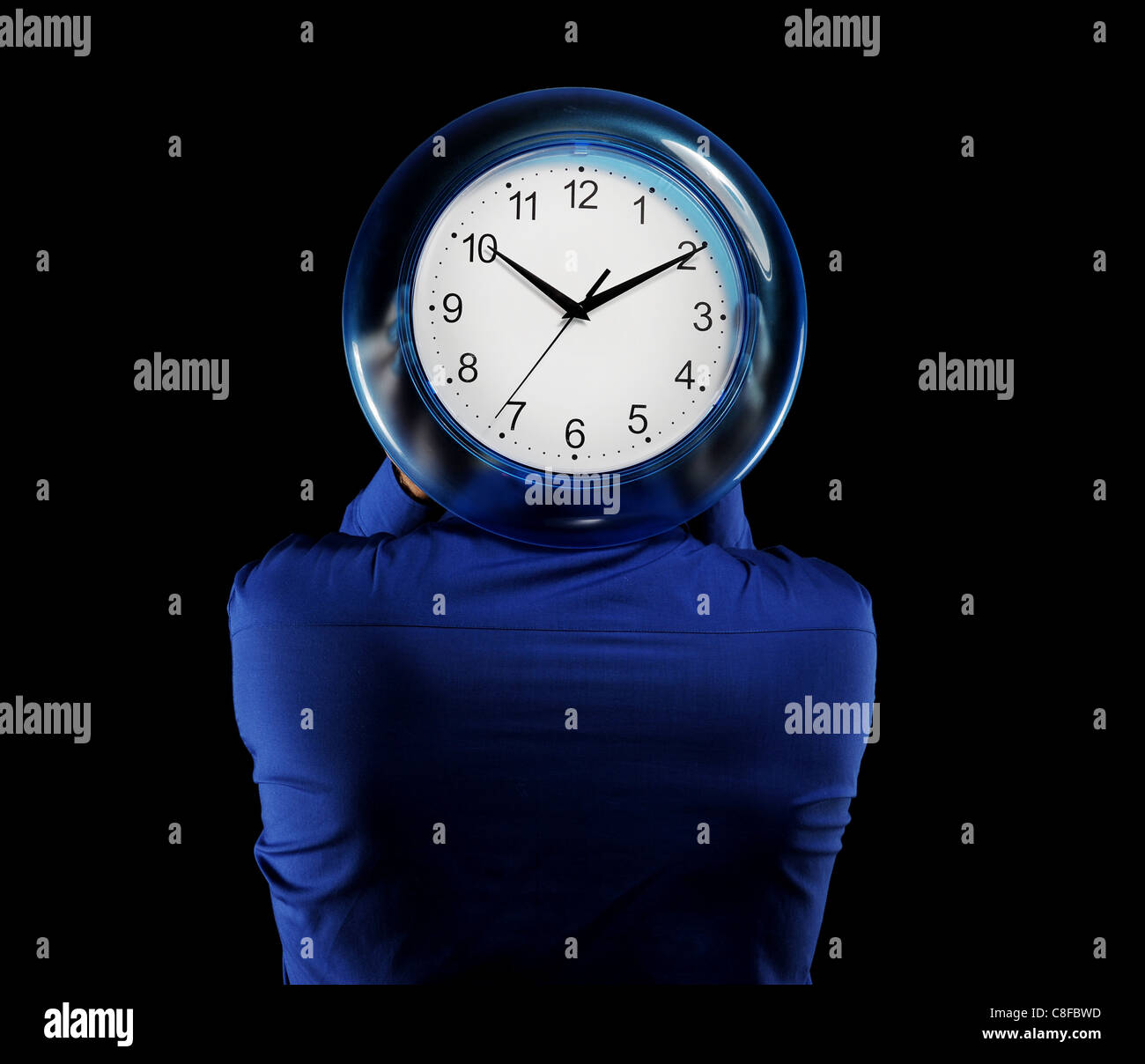 man holds hours Stock Photo - Alamy