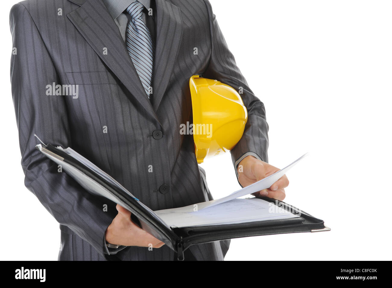 Businessman with construction helmet Stock Photo - Alamy