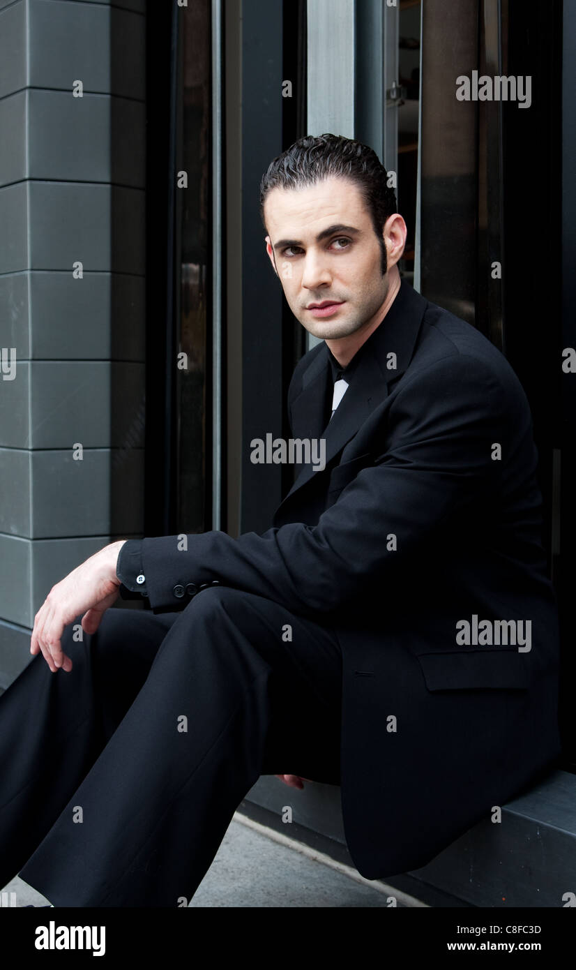 Business man sitting Stock Photo - Alamy