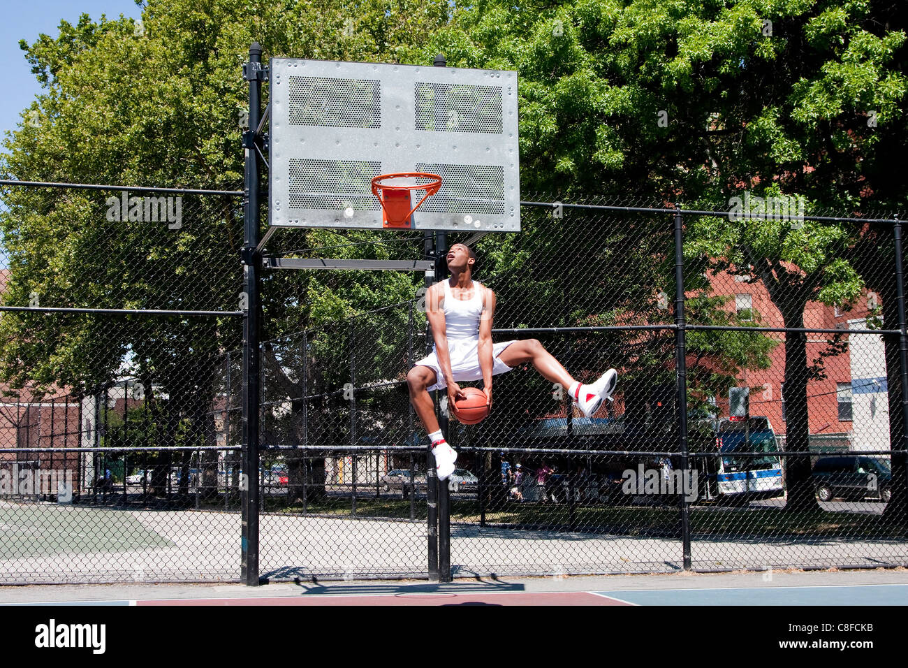 Jumping basketball player Stock Photo - Alamy
