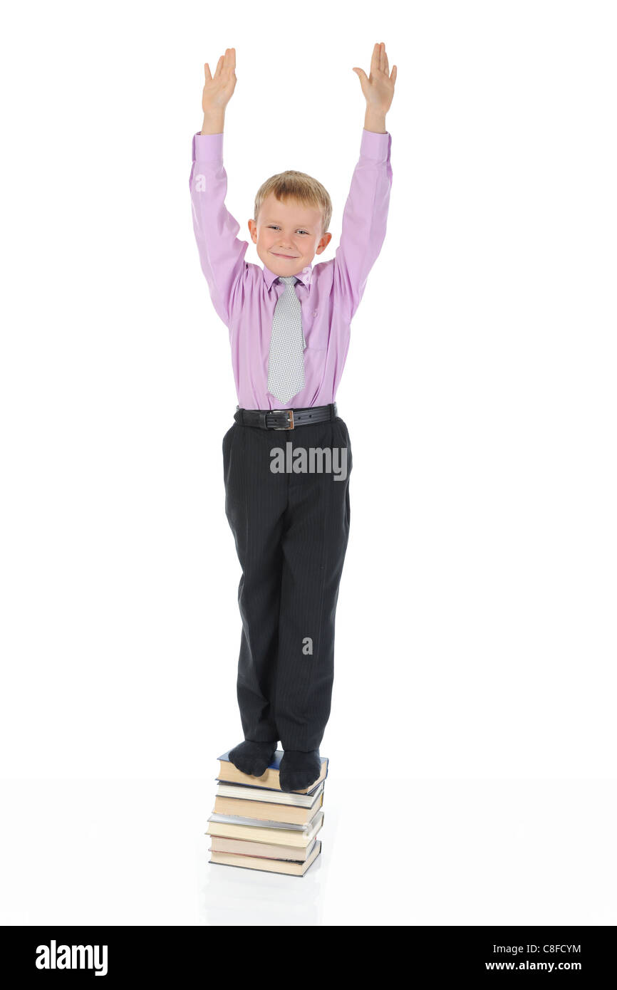 Kid standing on pile books hi-res stock photography and images - Alamy