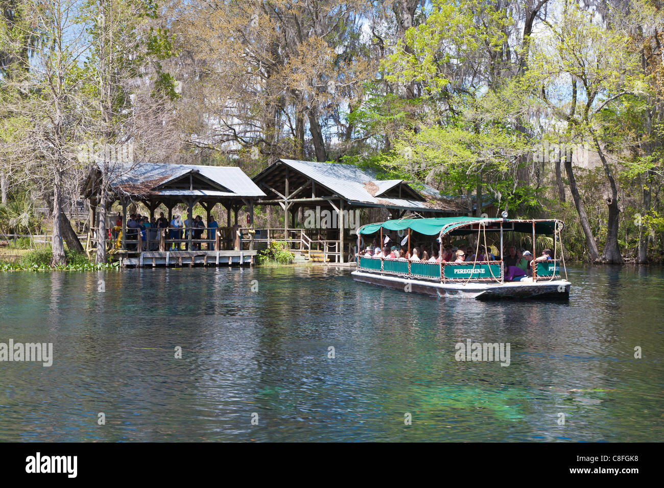 Visitors take boat tour on Silver River at Silver Springs Attractions ...