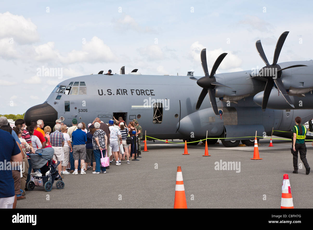 People line up to walk through a Hurricane Hunter Lockheed WC-130 ...