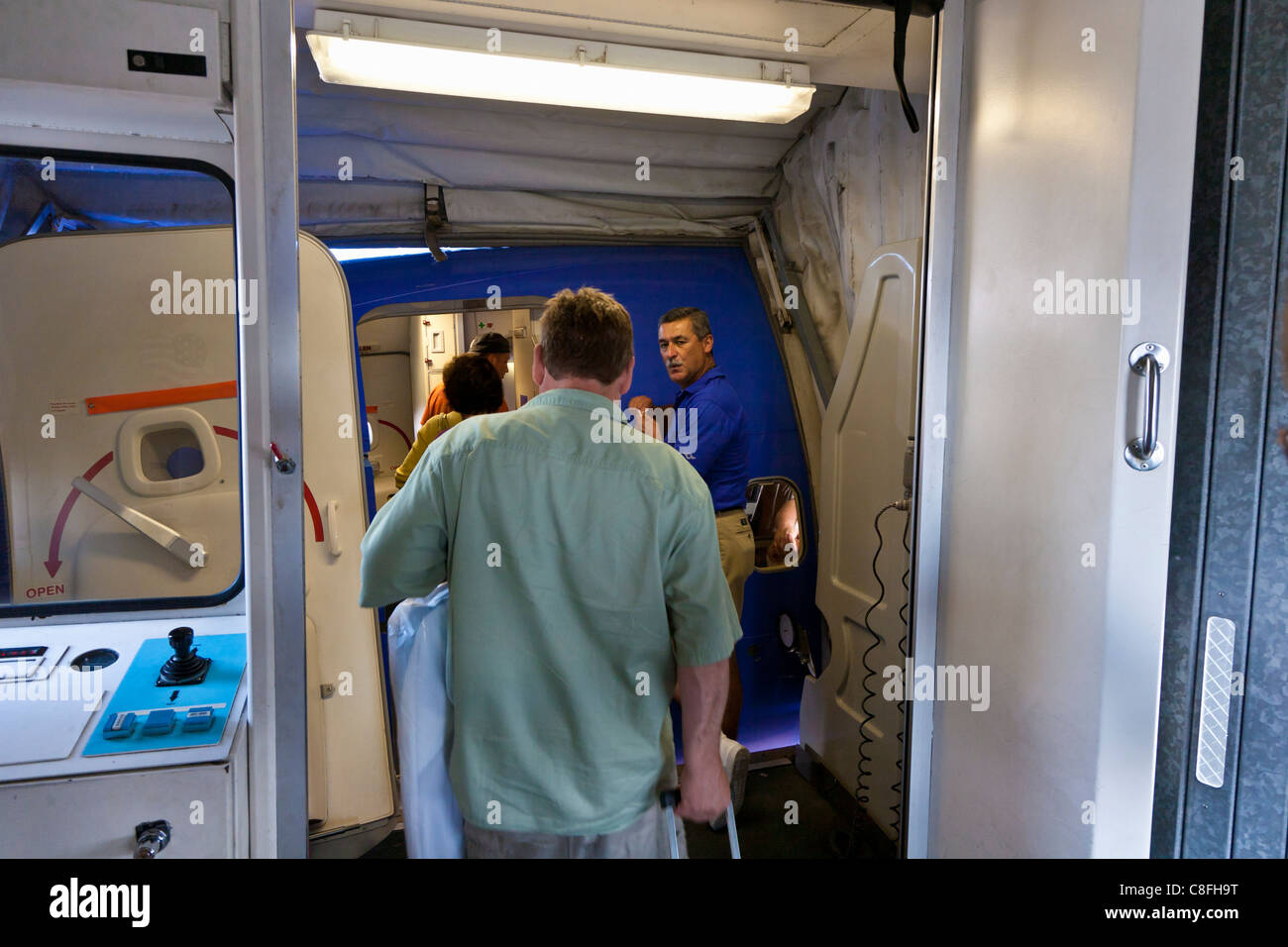 Passengers entering jet aircraft at Orlando International Airport in ...