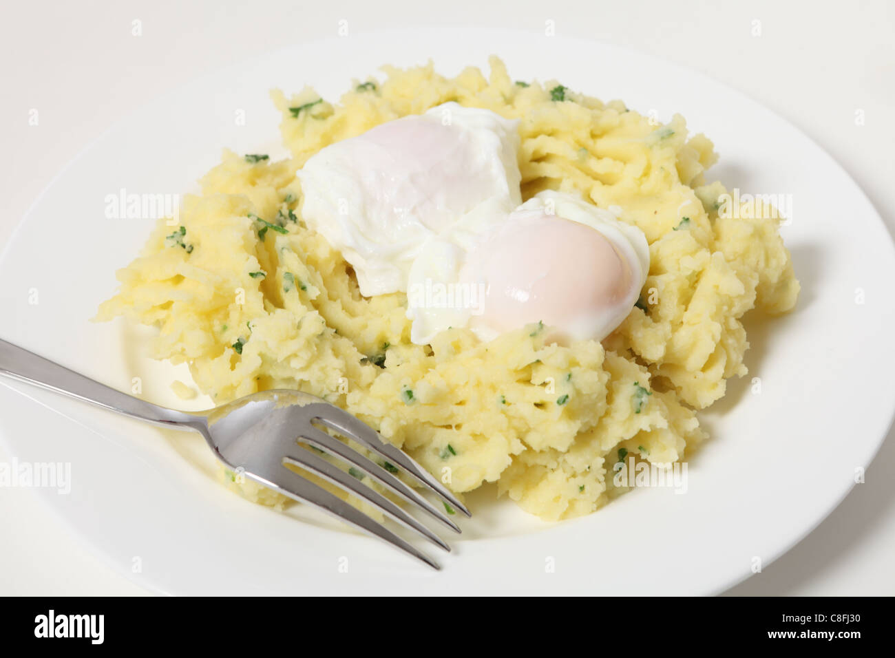 A quick and economical meal of poached eggs in a nest of mashed parsley ...
