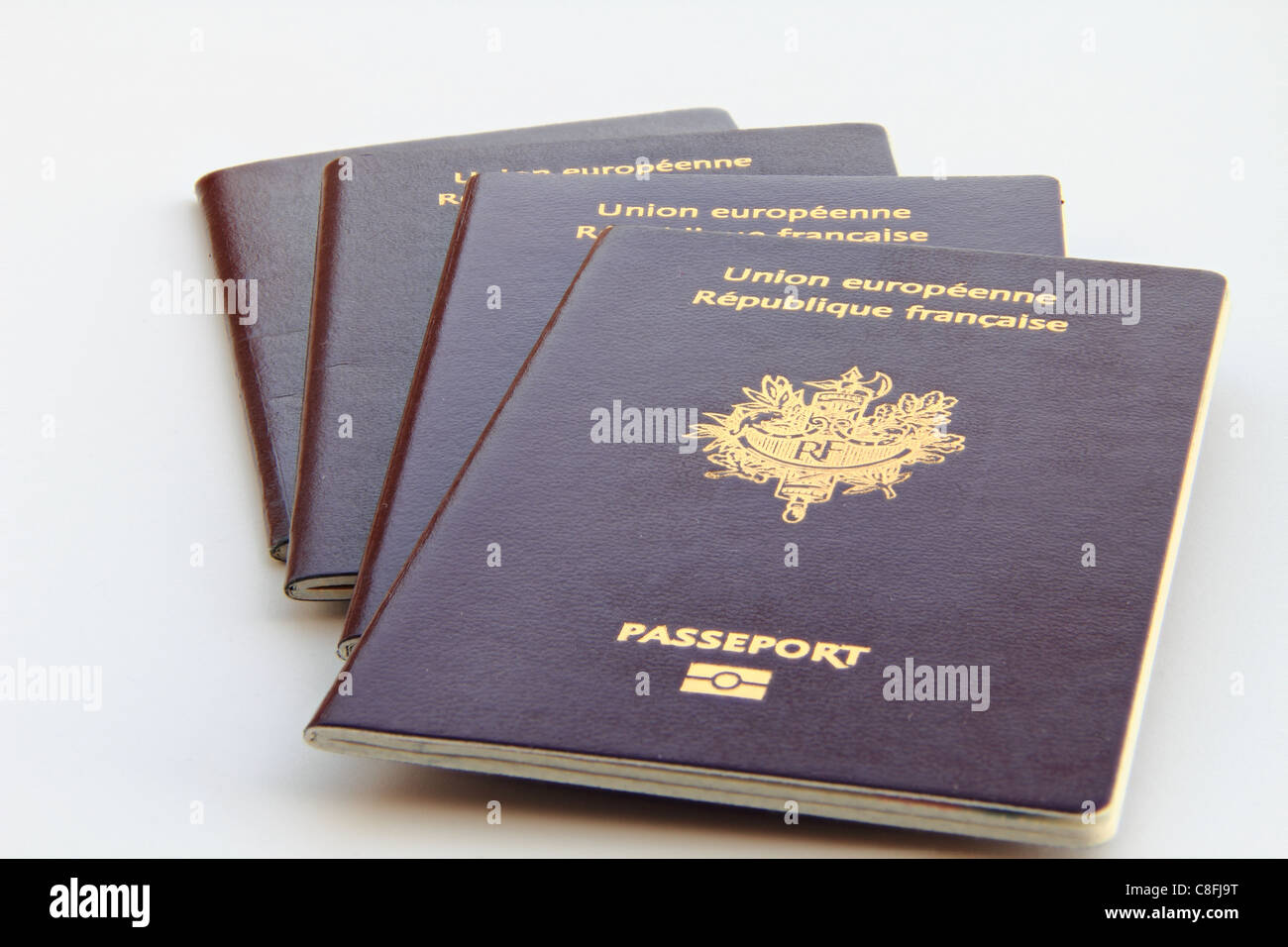 stack of biometric passports on white background Stock Photo - Alamy