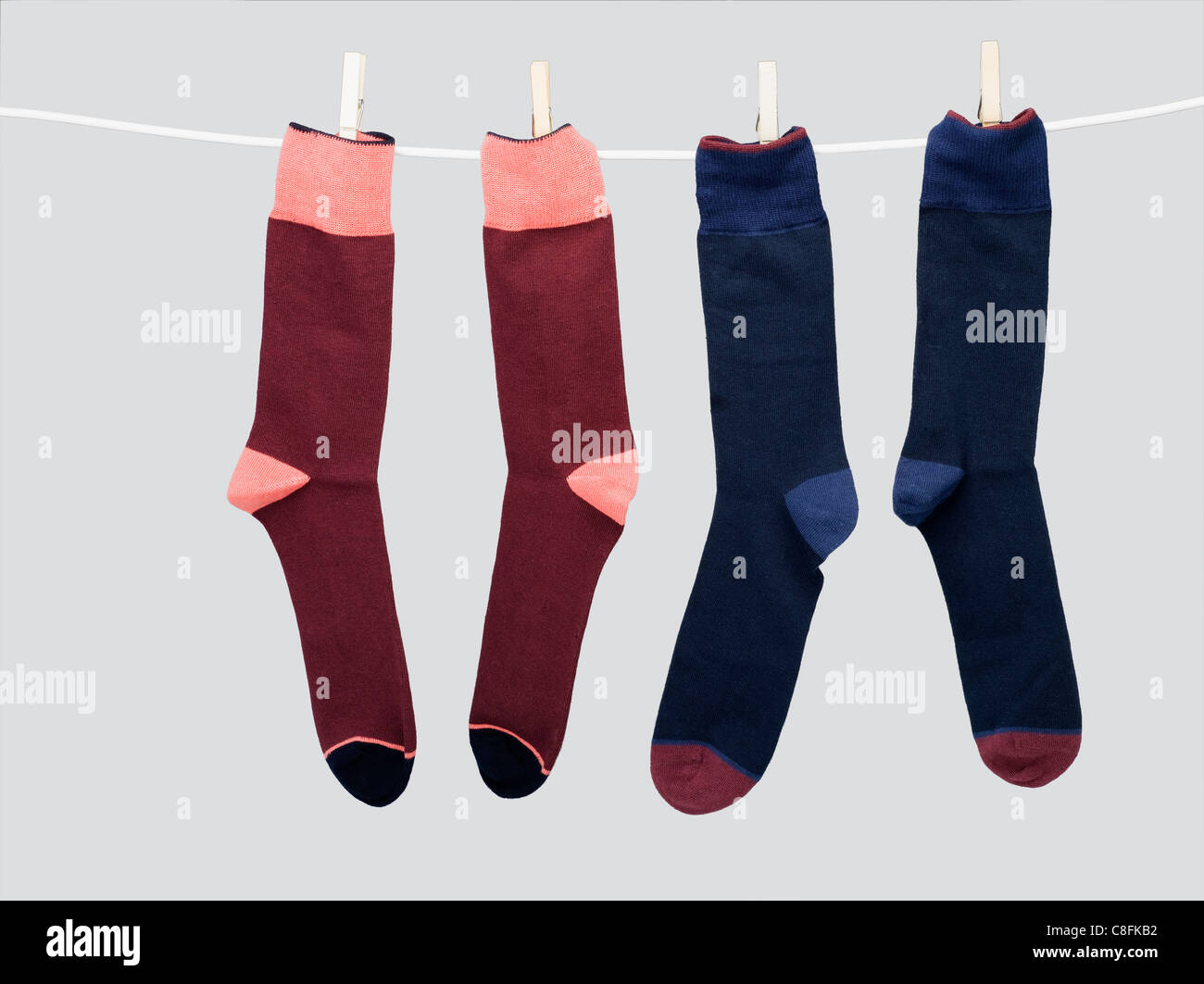 Two pairs of socks hanging from a clothes line Stock Photo - Alamy