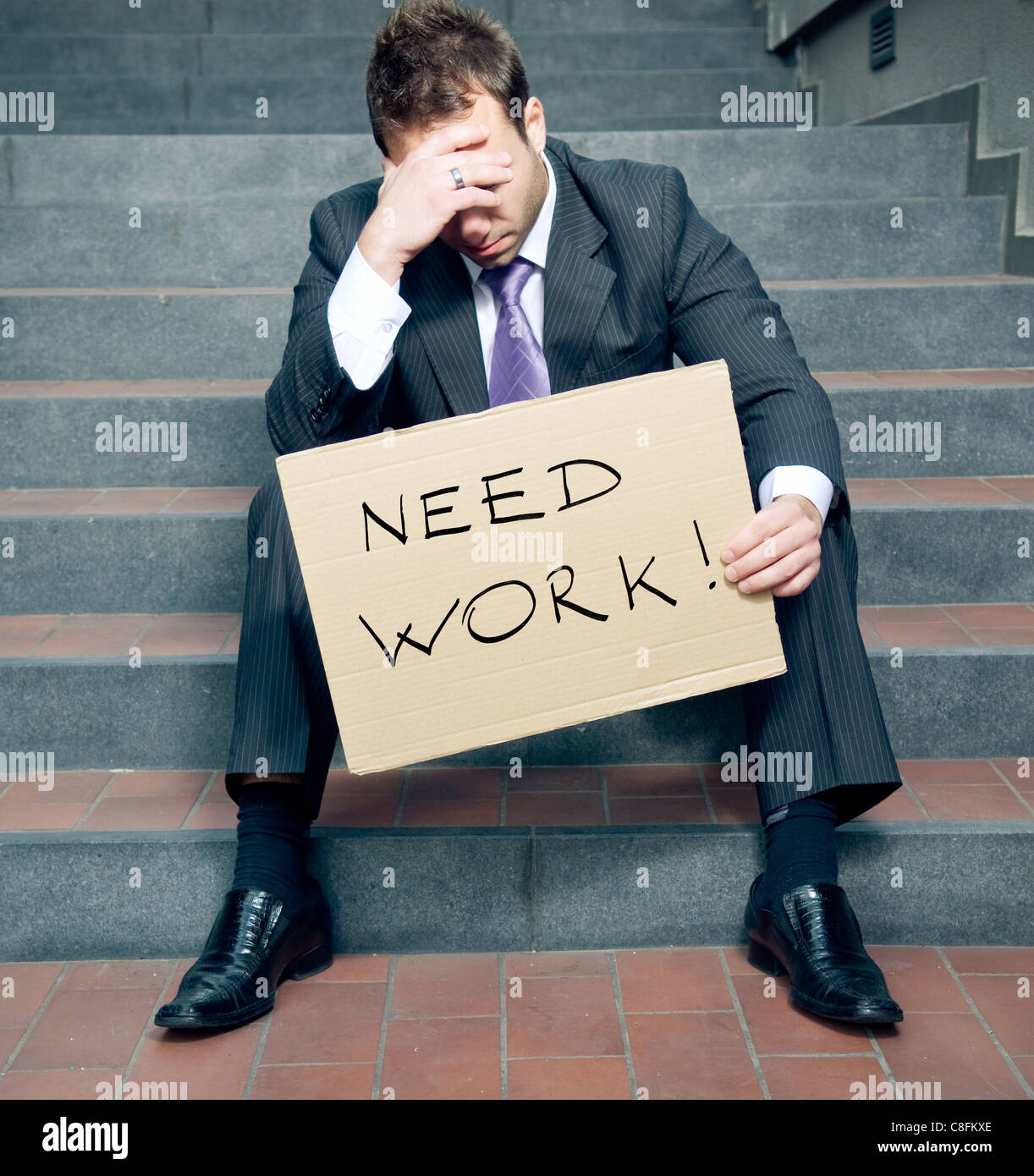 Desperate businessman showing negative graph Stock Photo - Alamy