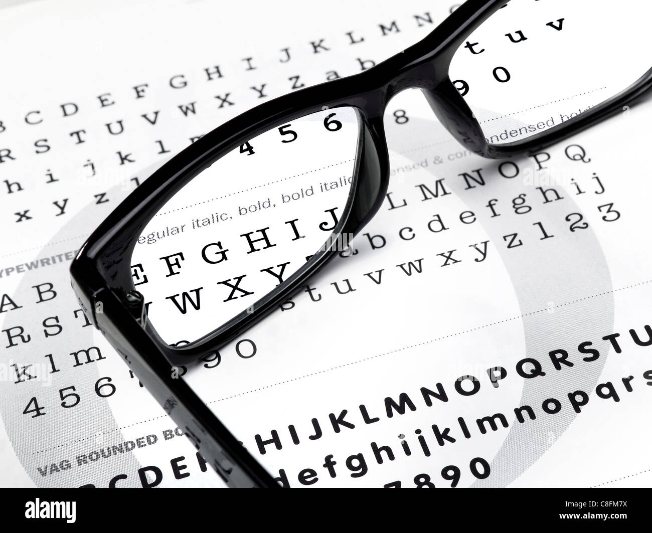 magnifying glasses on a writing background Stock Photo - Alamy